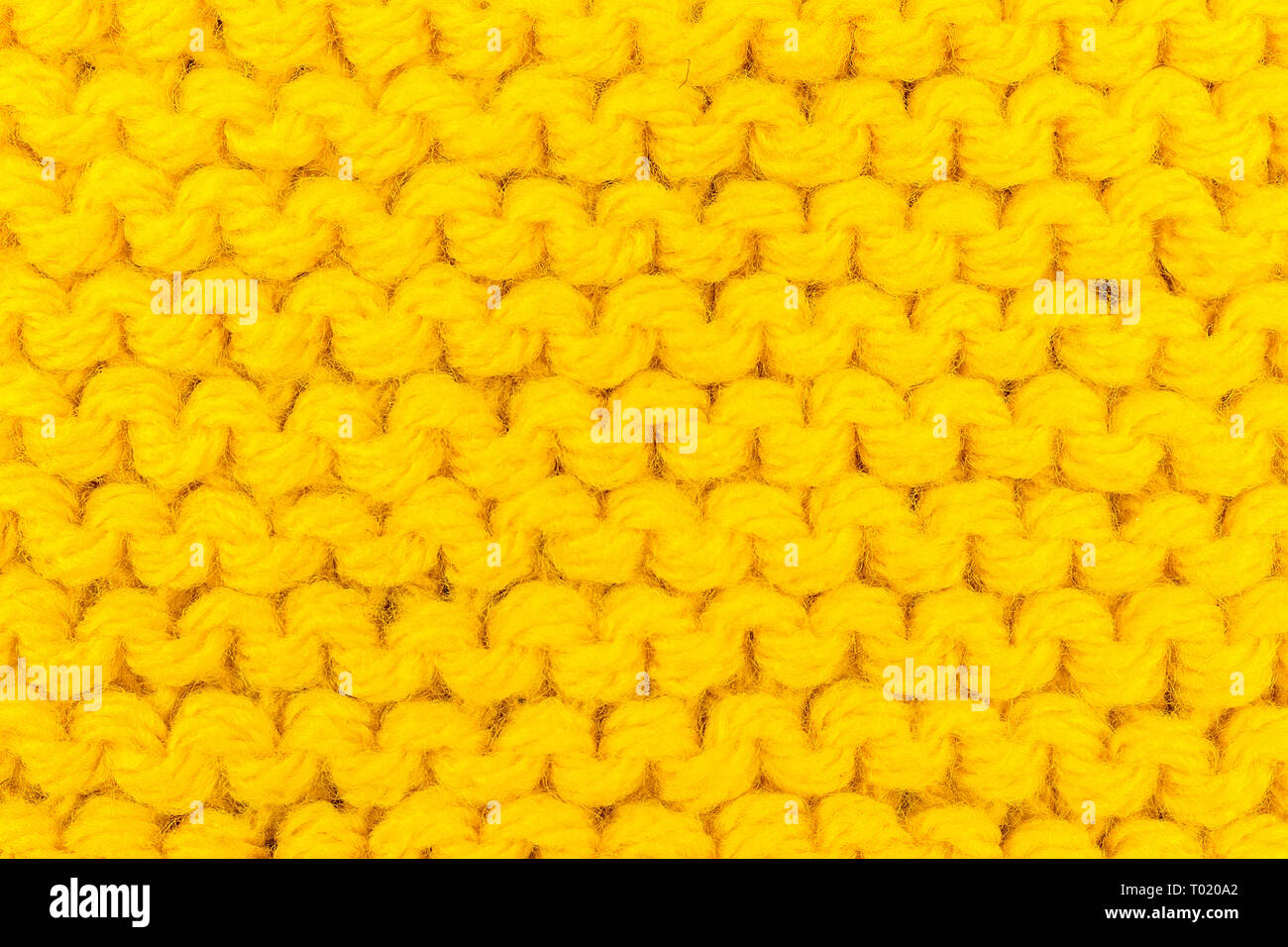 the texture of the crochet, yellow background, patterned knitted fabric ...