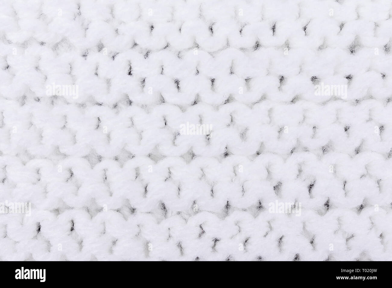 the texture of the crochet, white background, patterned knitted fabric ...