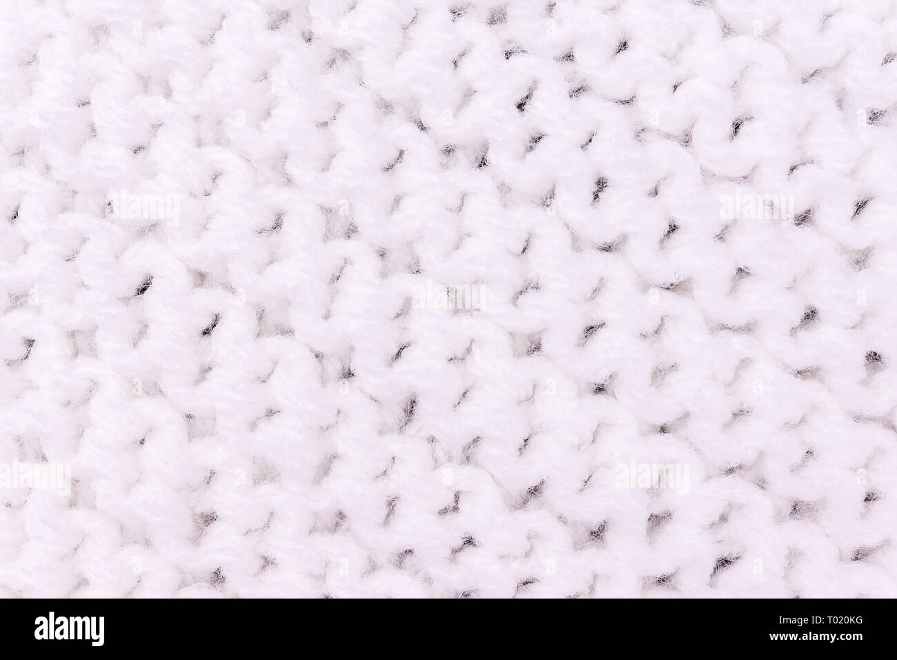 the texture of the crochet, white background, patterned knitted fabric ...