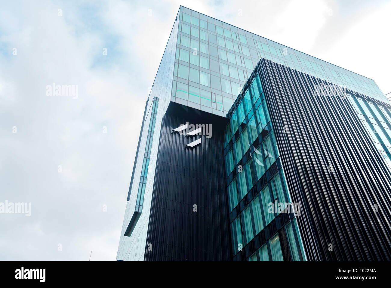 Glass skyscrapers of irregular shape. Bottom view. Abstract ...