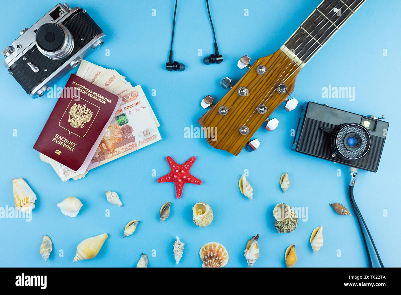 Camera seashells on blue hi-res stock photography and images - Alamy