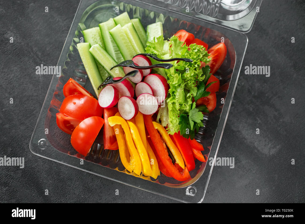 Assortment of fresh vegetables in plastic packaging. Concept of food ...