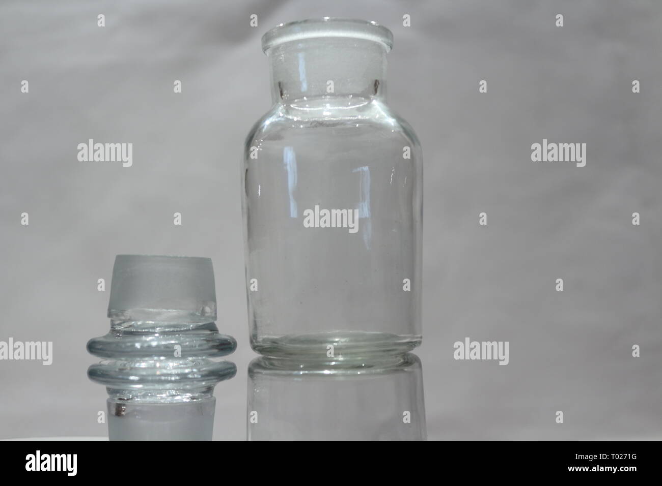 Glass container with reflection Stock Photo - Alamy