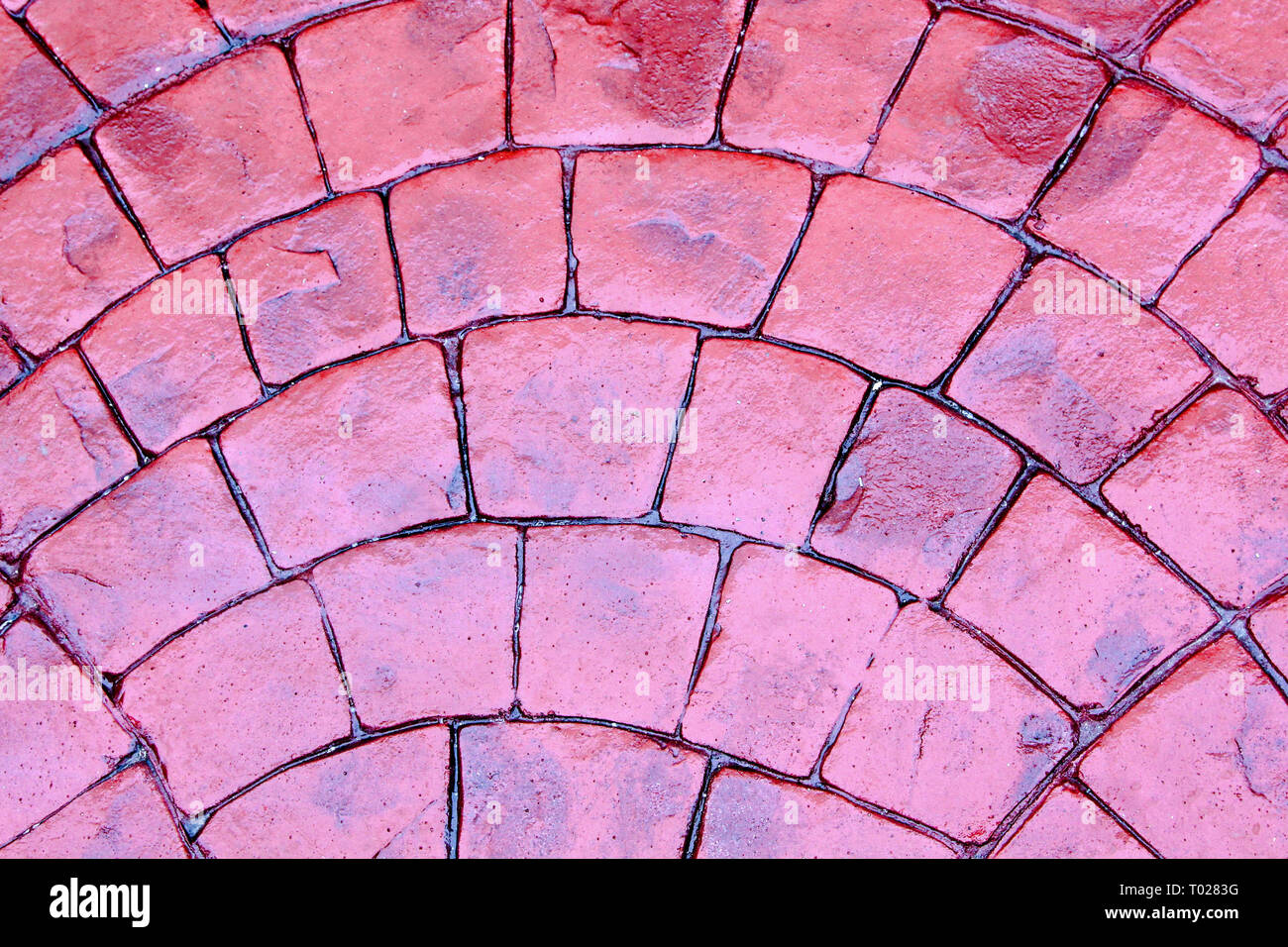 Detail of shiny road made of pink cobble Stock Photo - Alamy