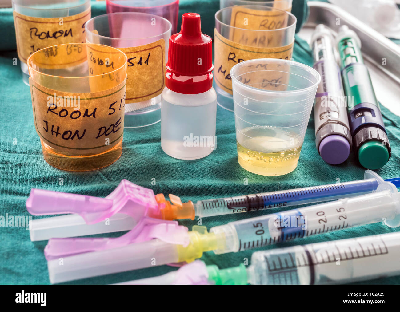 Diverse medication in glasses monodose along with insulin injectors in ...