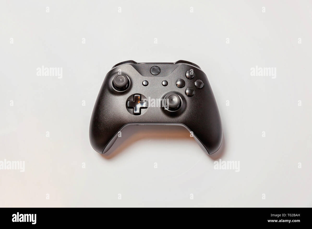 Black joystick gamepad, game console isolated on white background. Computer gaming technology ...