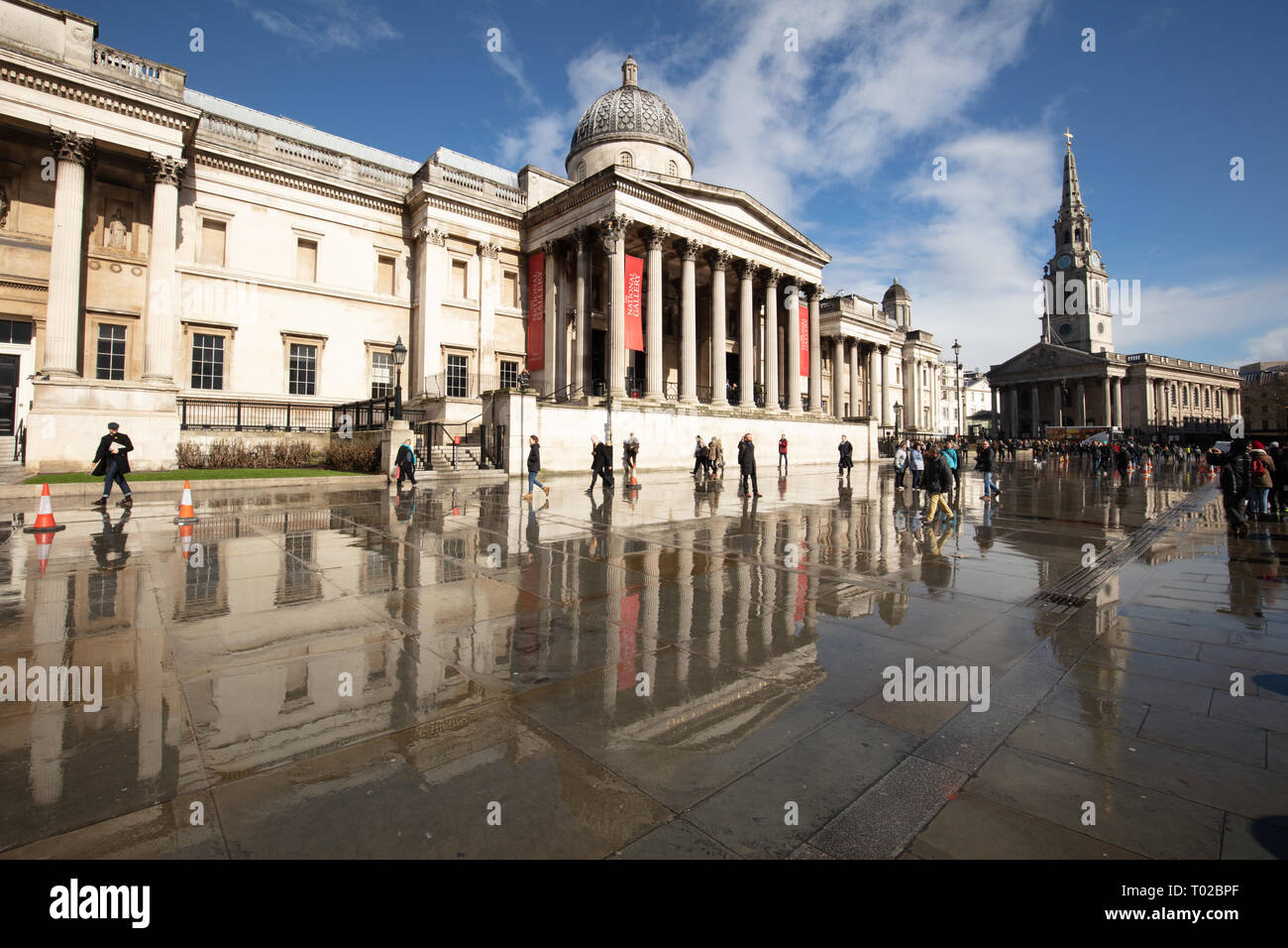 Trafalgar Square terrace in full sun after the rain with the National ...