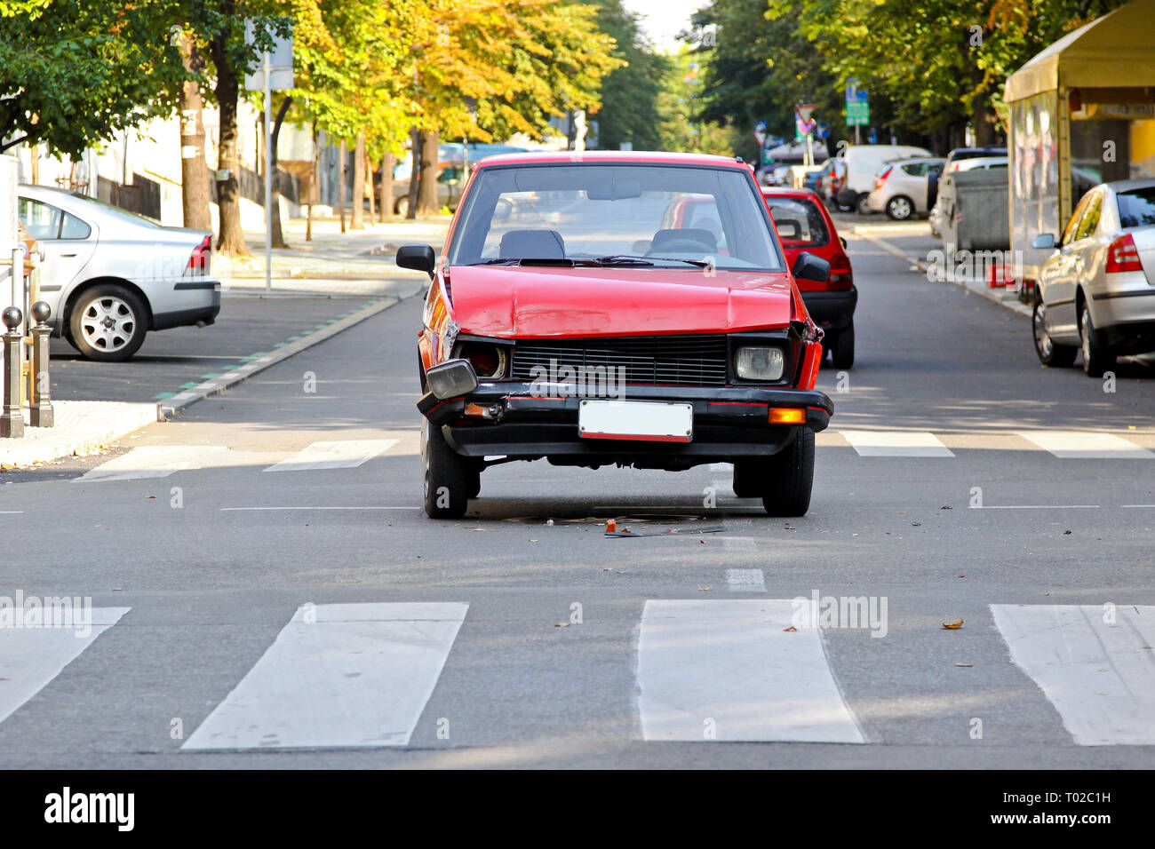 Damaged old red car after traffic accident Stock Photo - Alamy