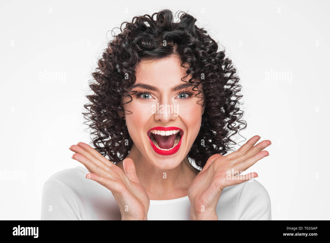 Surprised young woman shouting over hi-res stock photography and images ...