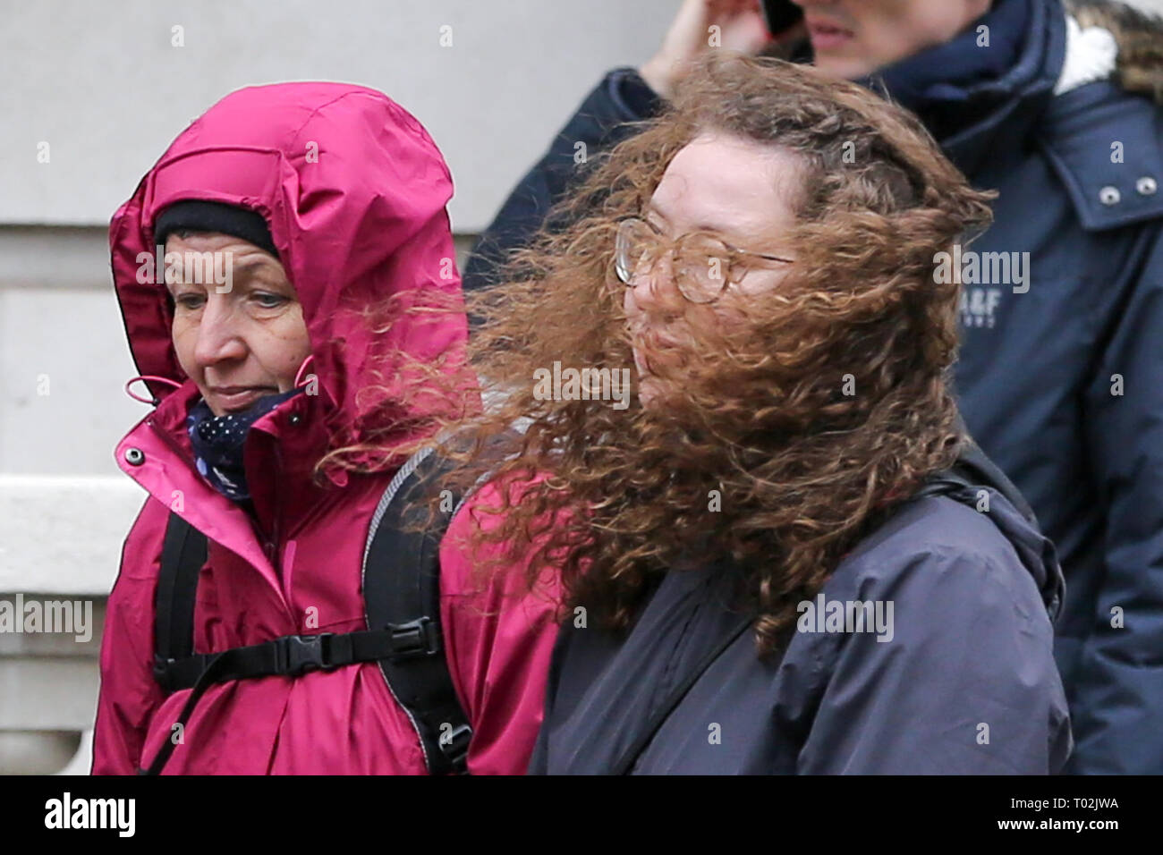 London, UK. 16th March 2019. Woman's hair blowing during strong wind in ...