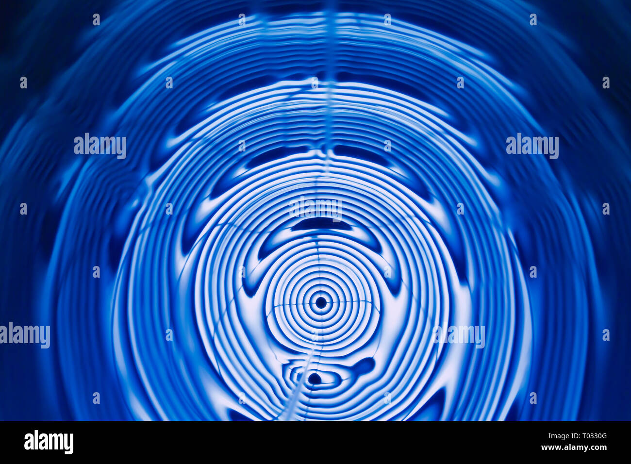 Sound waves in the visible blue color in the dark Stock Photo - Alamy