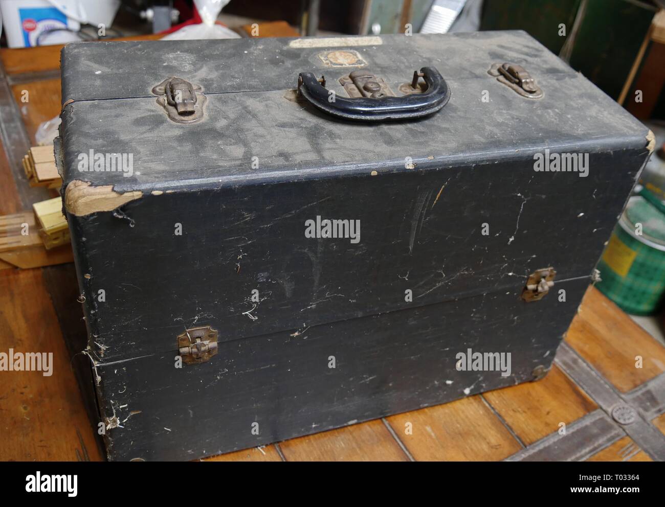 Battered and dusty black wooden chest with rusty knobs and locks Stock ...