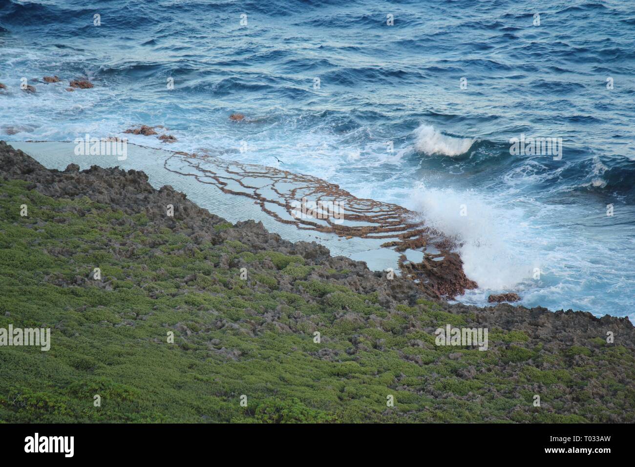 Aerial view of a beautiful coastline at a tropical beach with waves ...