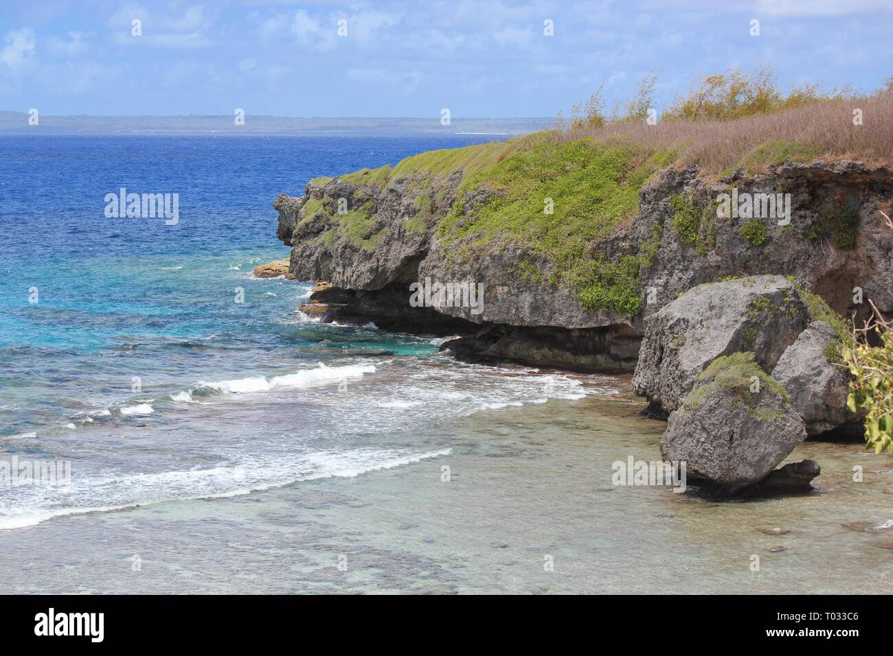 Beautiful and scenic cliff lines at Ladder Beach, Saipan Stock Photo ...