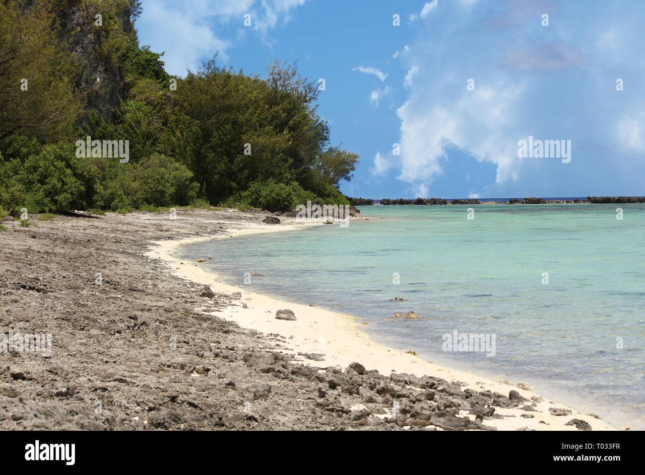 Beach with sharp corals on the shorelines, with crystal clear waters ...