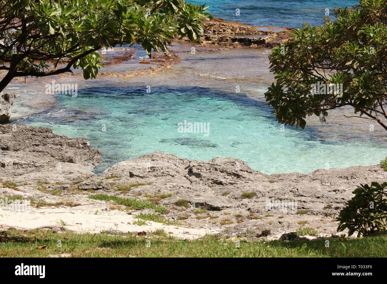 Natural swimming hole on Rota, Northern Mariana Islands, framed by two ...