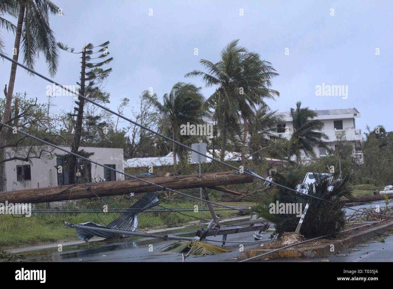 The day after a typhoon hit a tropical island uprooting electric power ...