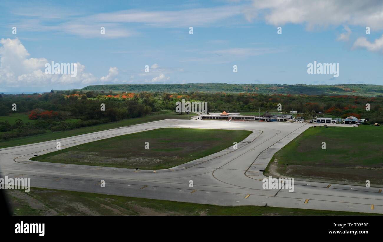 TINIAN, CNMI, USA—OCTOBER 2016: Low aerial shot of Tinian International ...