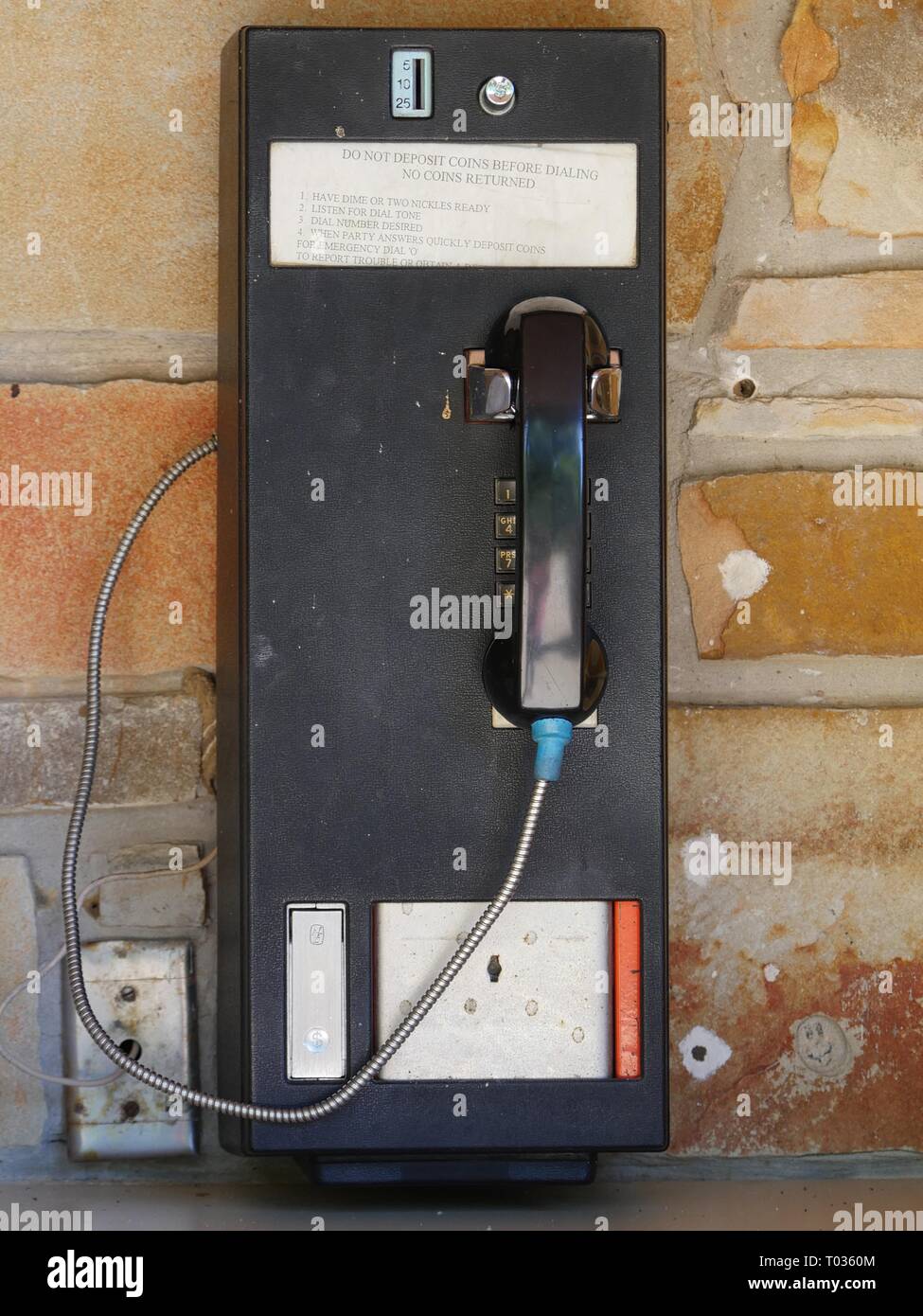 Wall mounted payphone hi-res stock photography and images - Alamy