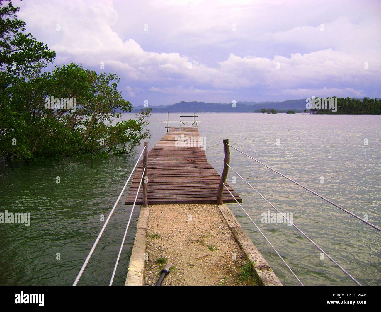 Wooden ramp at a beach in a tropical island Stock Photo - Alamy