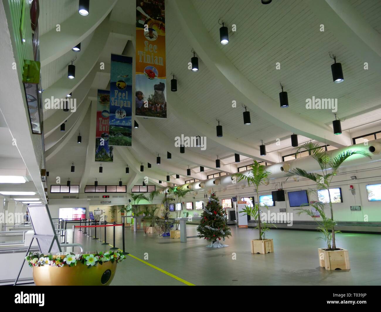SAIPAN, CNMI, USA—DECEMBER 2016: Wide shot inside the arrival area of ...