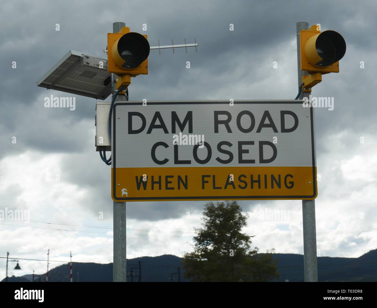 White and yellow warning sign with lights on the roadside in Dillon ...