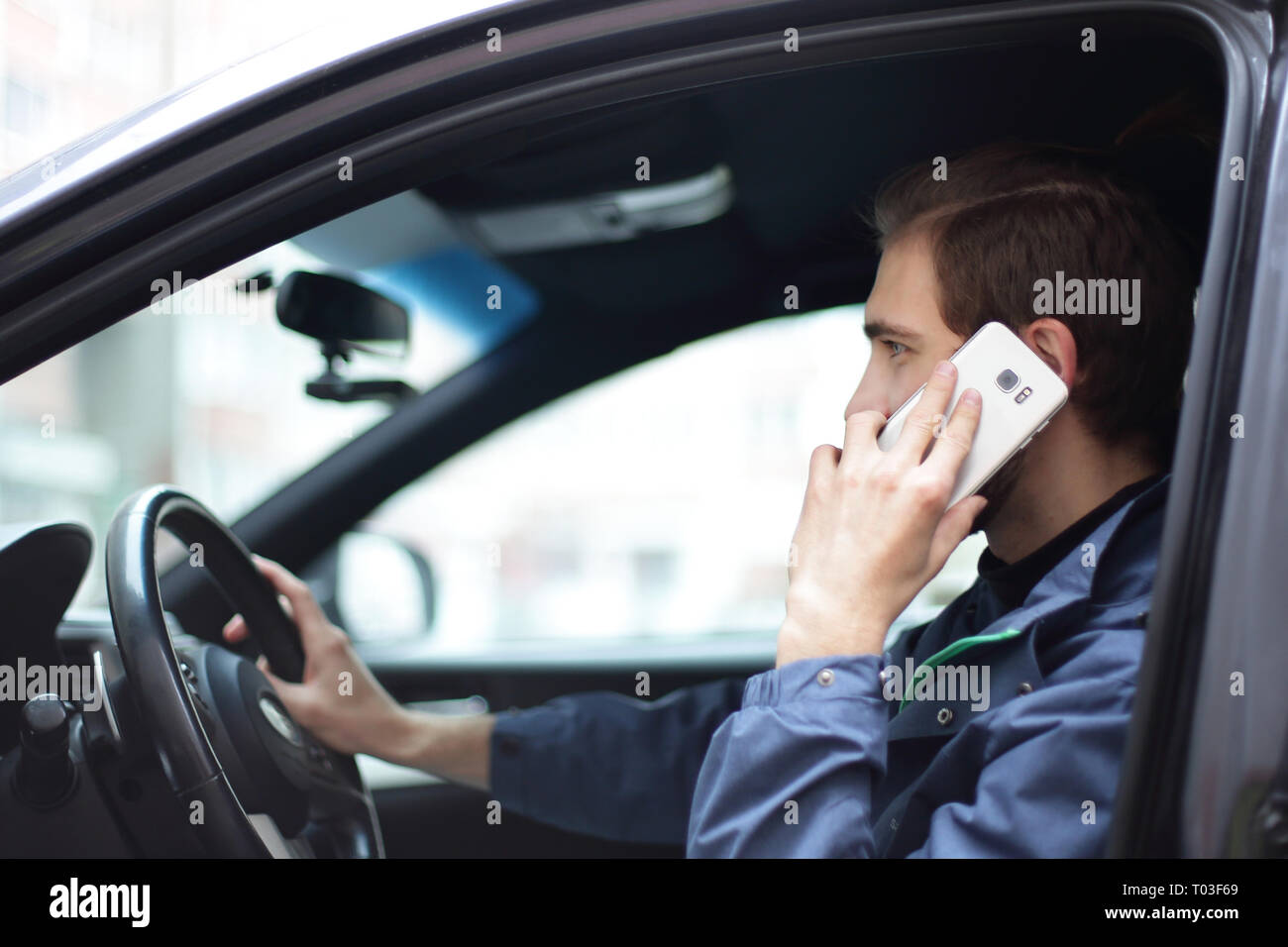 successful man talking on mobile phone in the car Stock Photo - Alamy