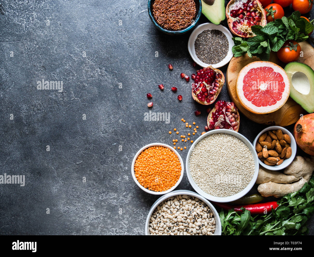 Fresh raw ingredients for healthy cooking. Vegetables, fruit, seeds ...