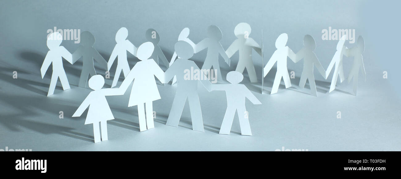 many paper men on the paper background Stock Photo - Alamy