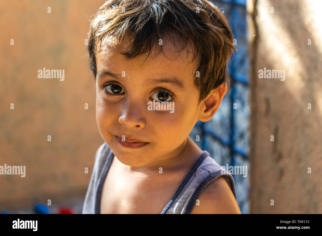 Hispanic boy with autism spectrum disorder looking at camera Stock ...
