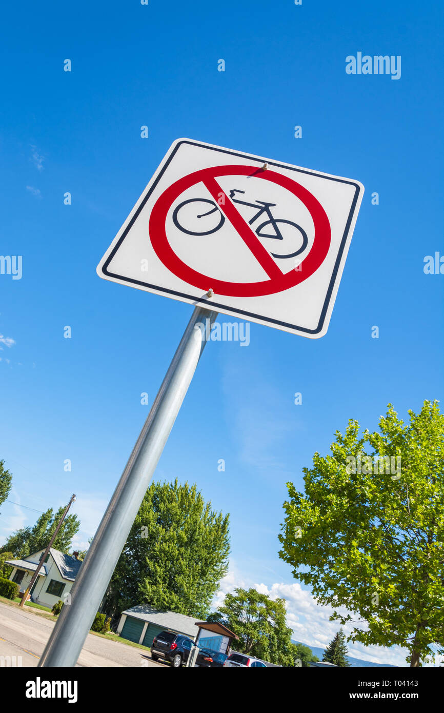 Road sign 'no bike' on the street on blue sky background Stock Photo ...