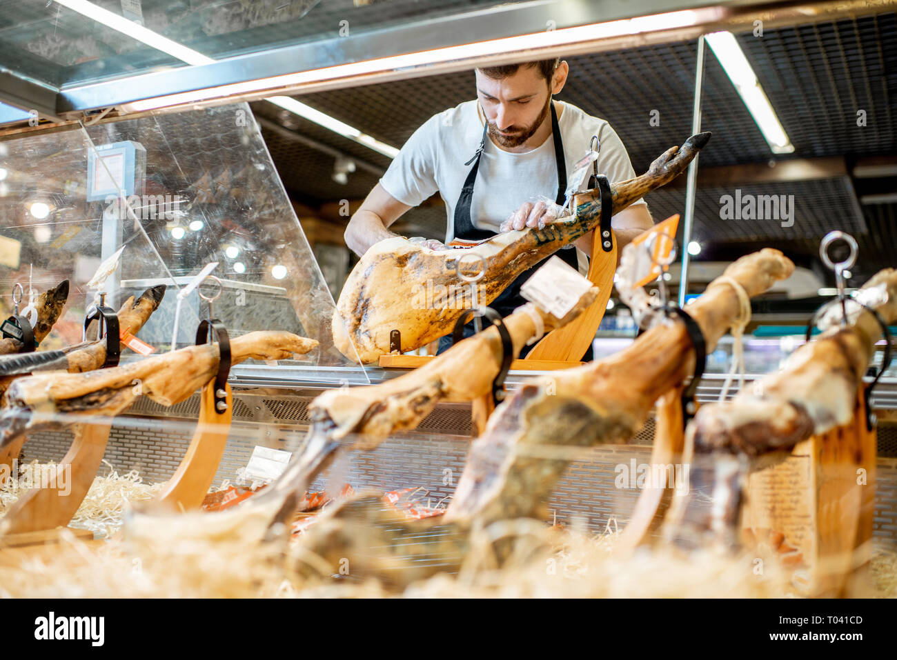 Seller cutting jamon ham slicing hi-res stock photography and images ...