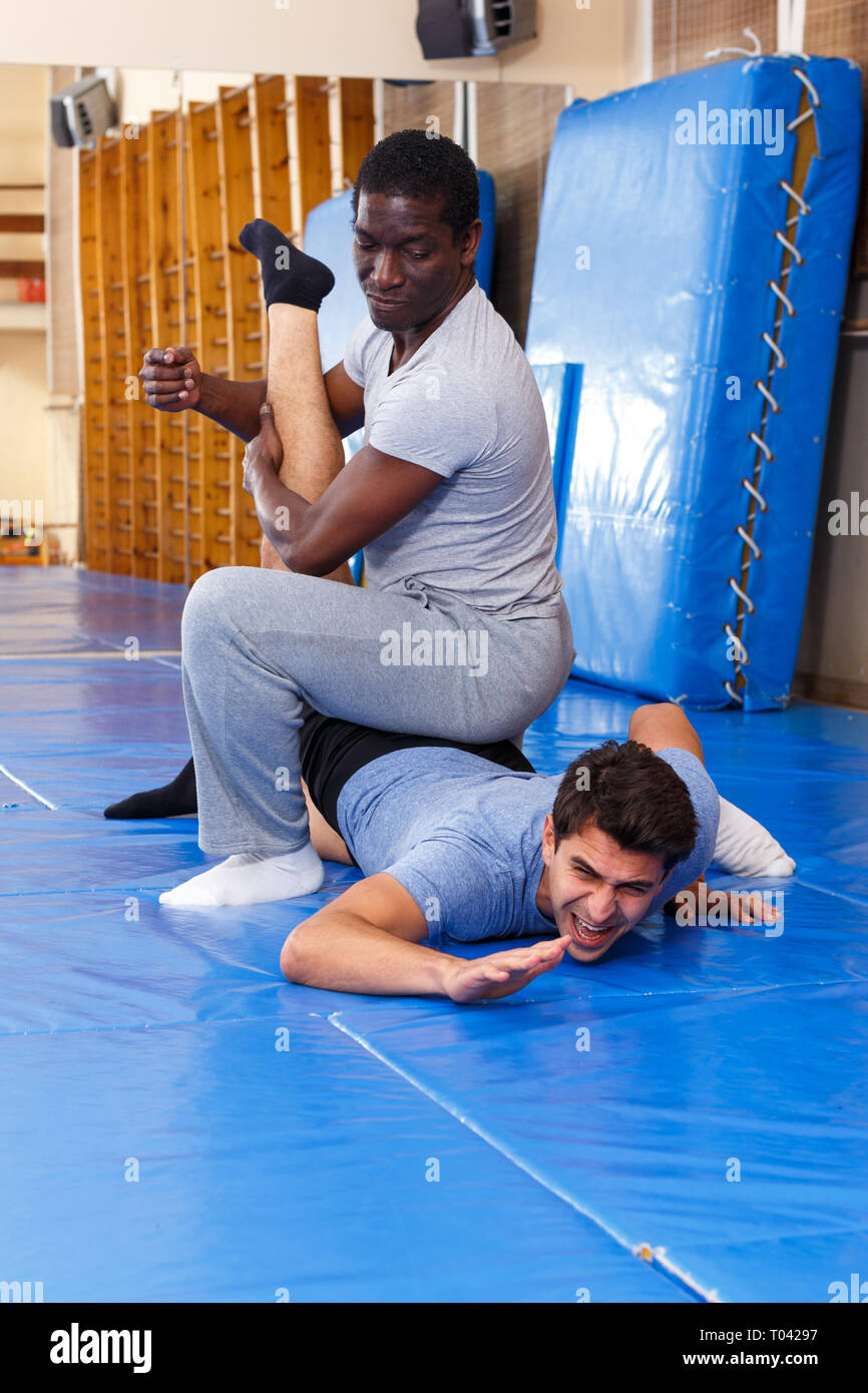 Males training attack movements in pair at self protection workout ...