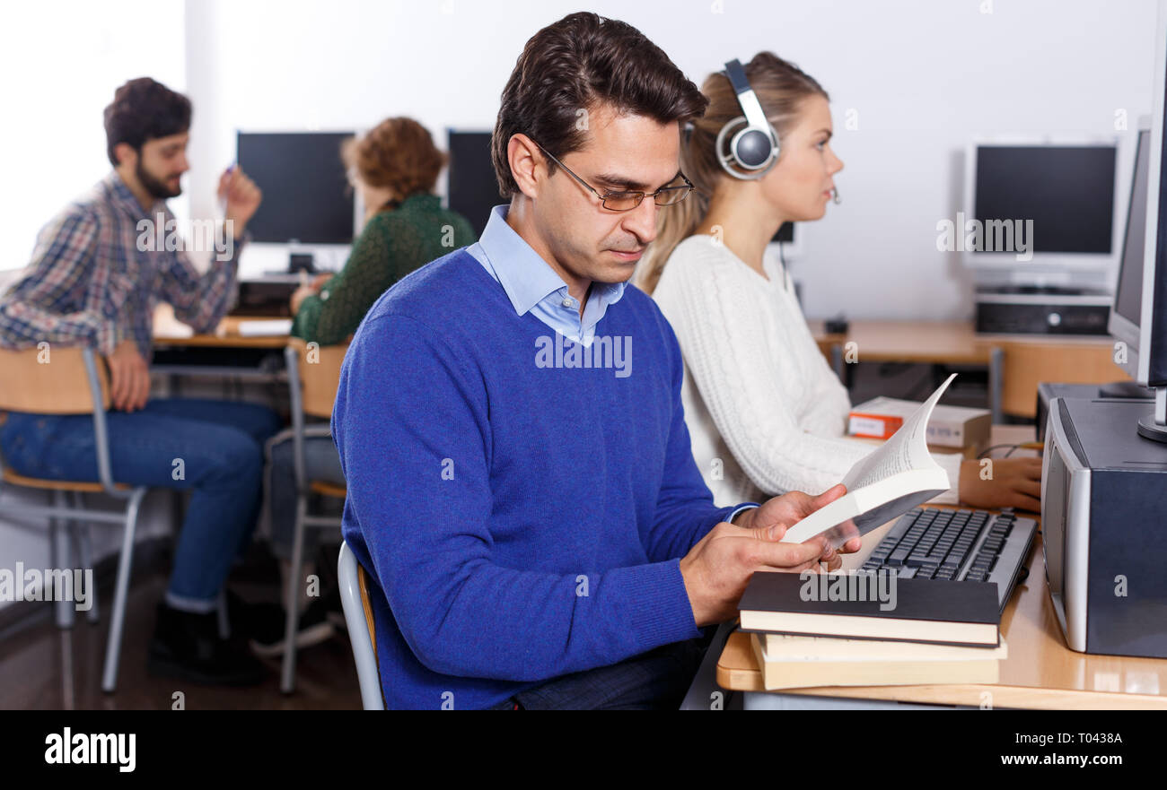 Reading computer interested hi-res stock photography and images - Alamy