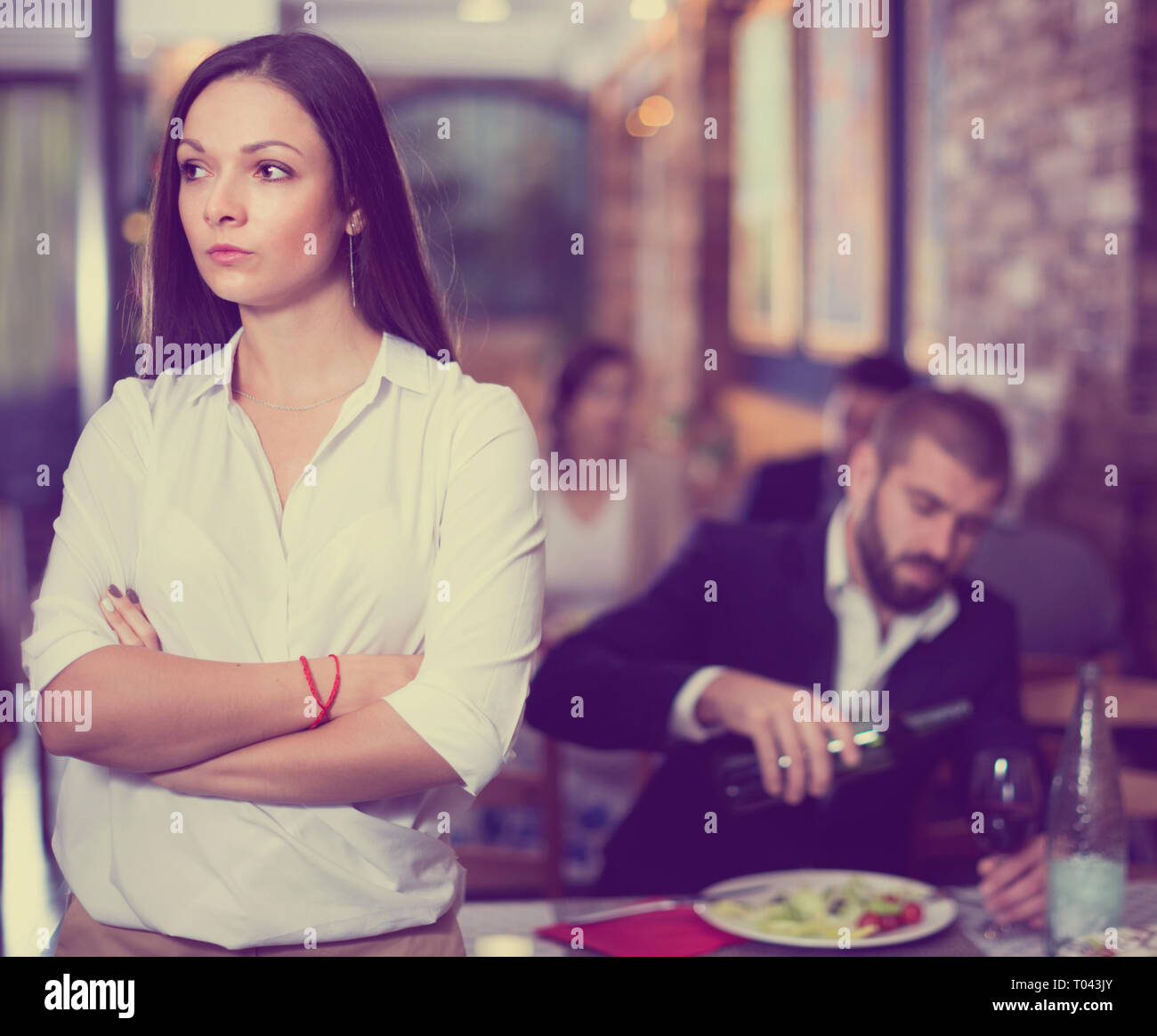 Portrait of upset evil angry man and woman in the restaurant on meeting ...