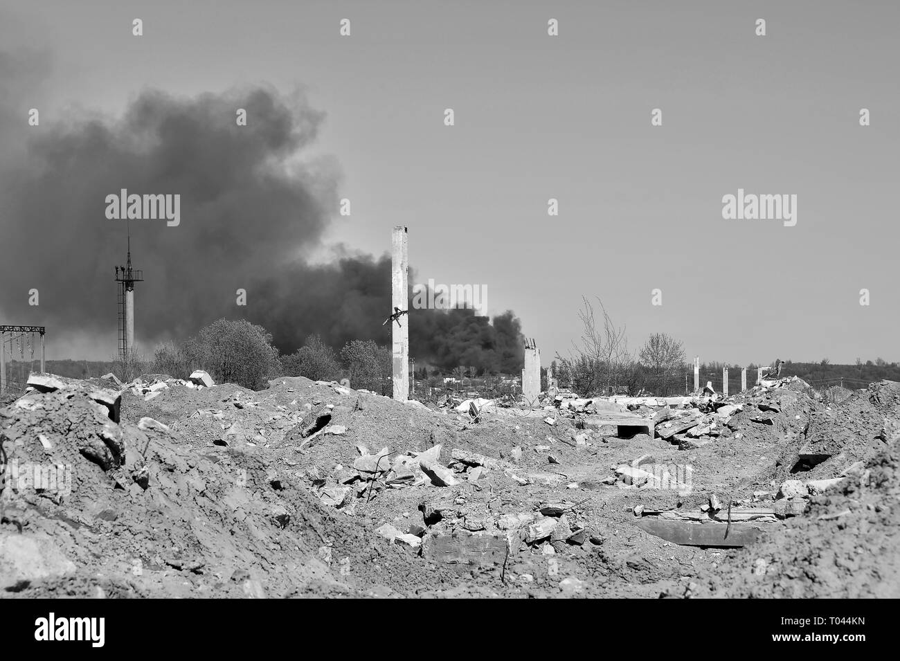 A pile of concrete rubble with protruding rebar on the background of ...