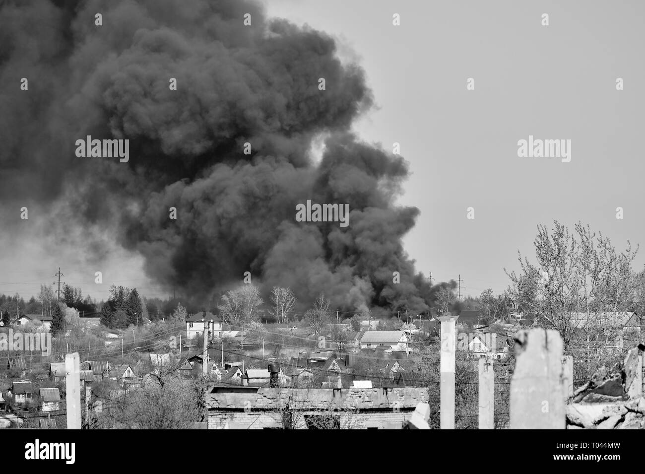 A pile of concrete rubble with protruding rebar on the background of ...