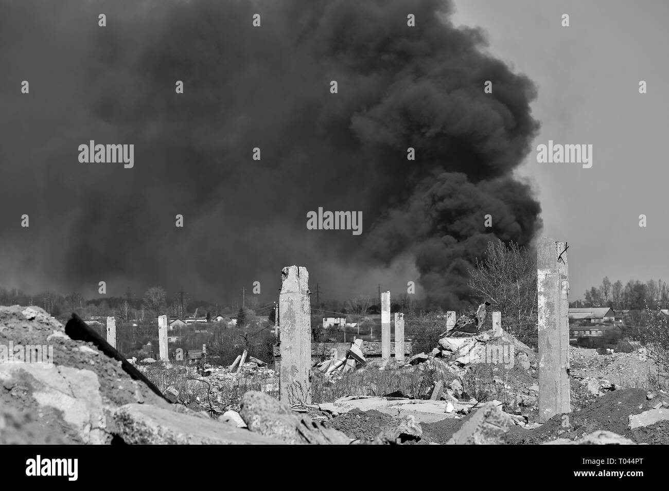 A pile of concrete rubble with protruding rebar on the background of ...