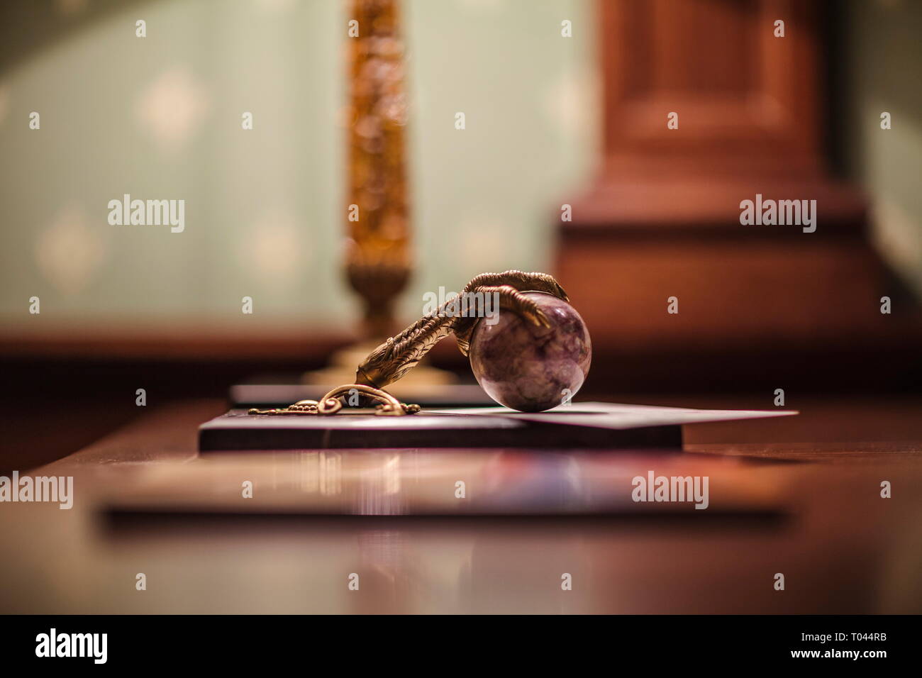 chicken claw as a press papier on the writing table Stock Photo - Alamy