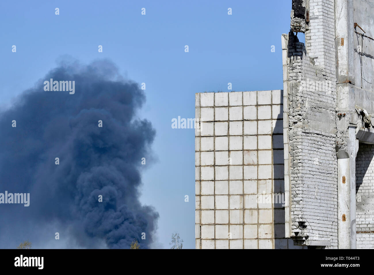 Template in the form of a building wall against the sky and thick black ...