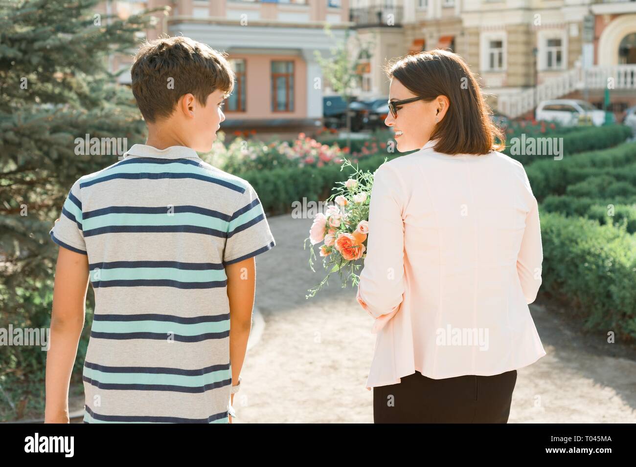 Mother teenage son back view hi-res stock photography and images - Alamy