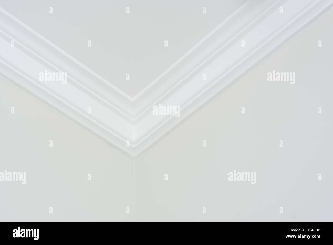 Ceiling moldings in the interior, a detail of corner Stock Photo - Alamy