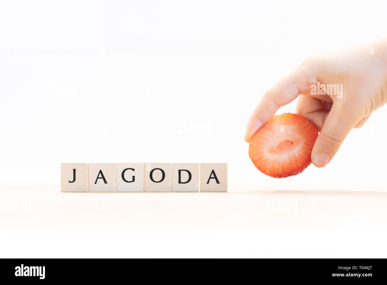 Wooden letters form the Croatian word Jagoda, which means strawberry ...