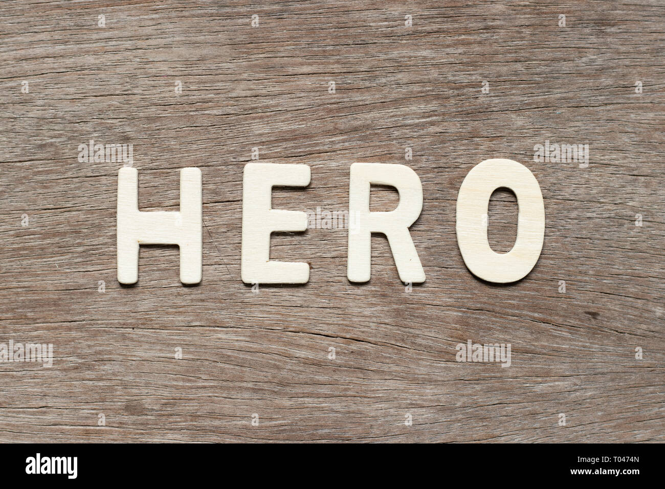 Alphabet letter in word hero on wood background Stock Photo - Alamy