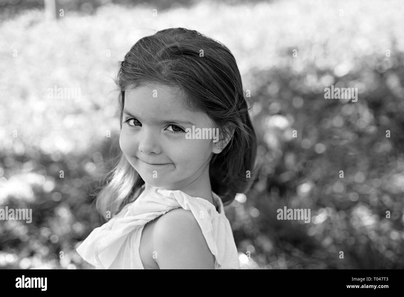 Summer girl fashion. Happy childhood. Little girl in sunny spring ...