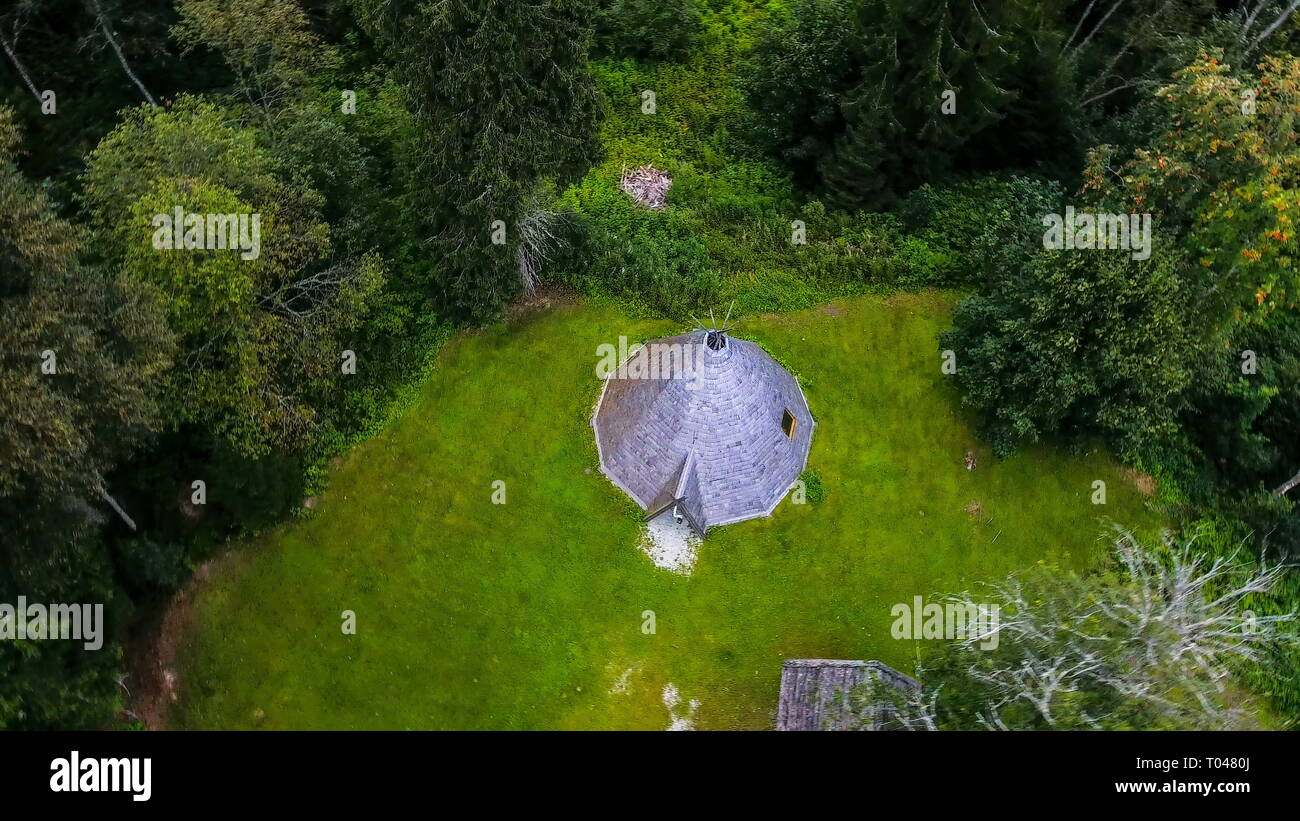 The aerial view of the teepee house in the forest filled with lots of ...