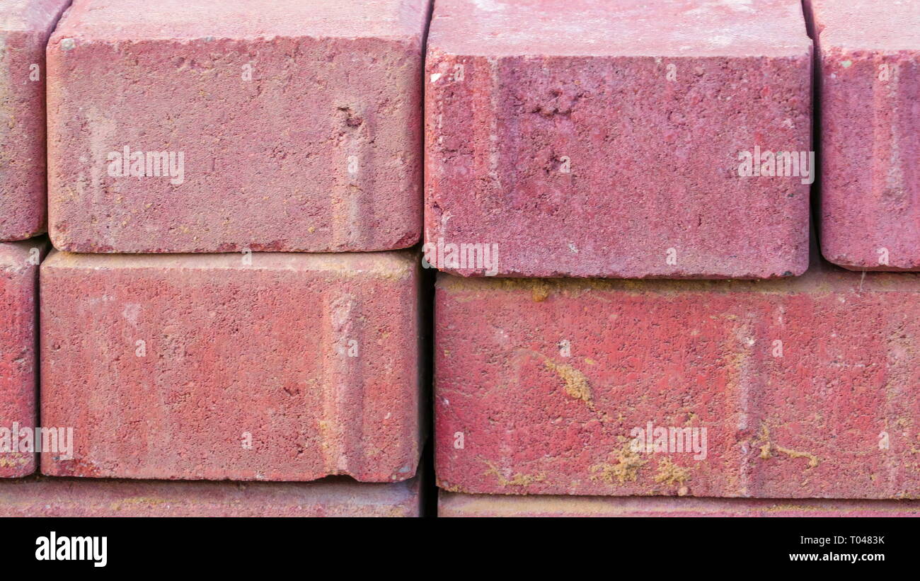 Closer look of the side part of the red bricks piled in order for ...