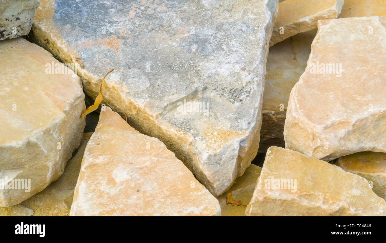 Big limestone rocks in different sizes on the floor the yellow colored ...