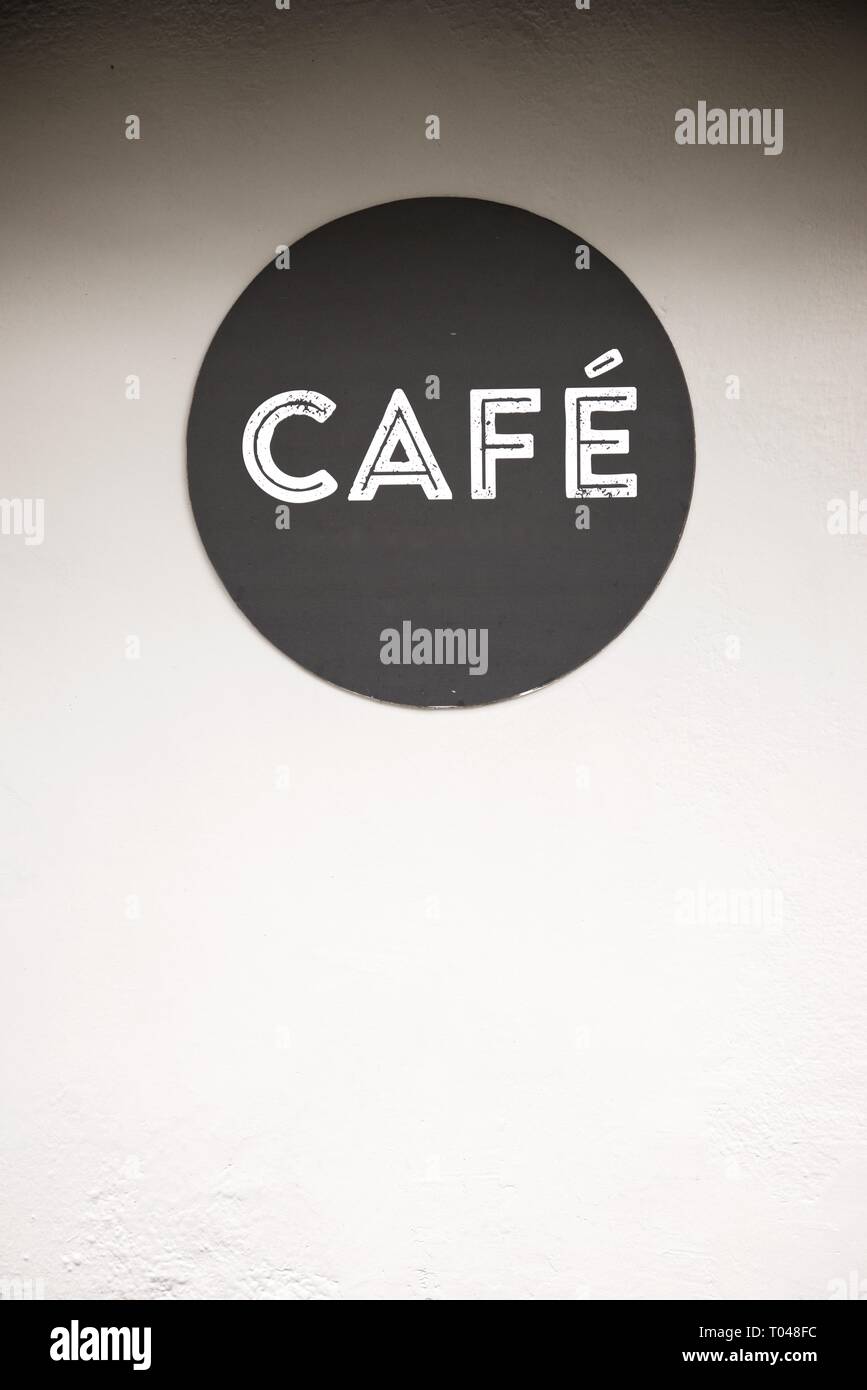 Cafe signboard on a white wall Stock Photo - Alamy