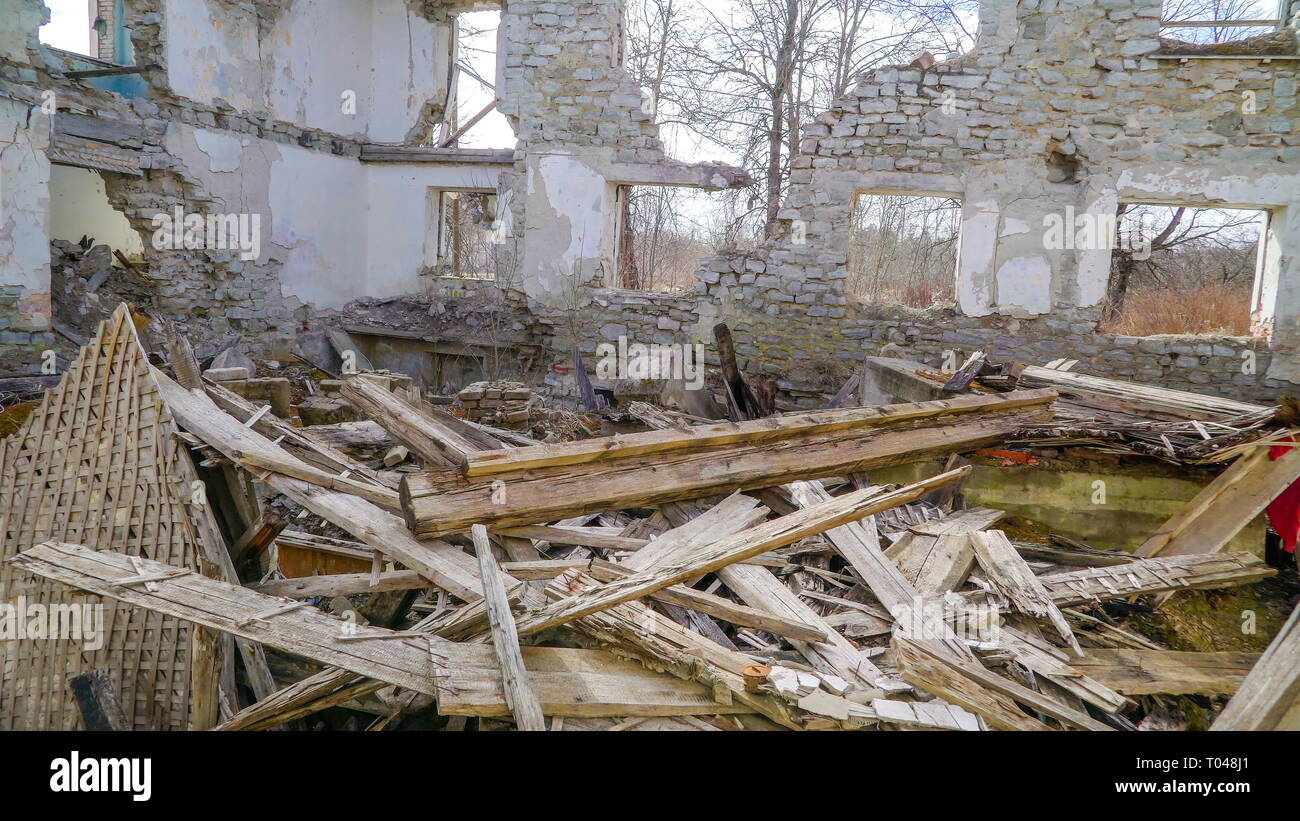 Lots of wooden rubbles on the floor of the house that was damaged ...